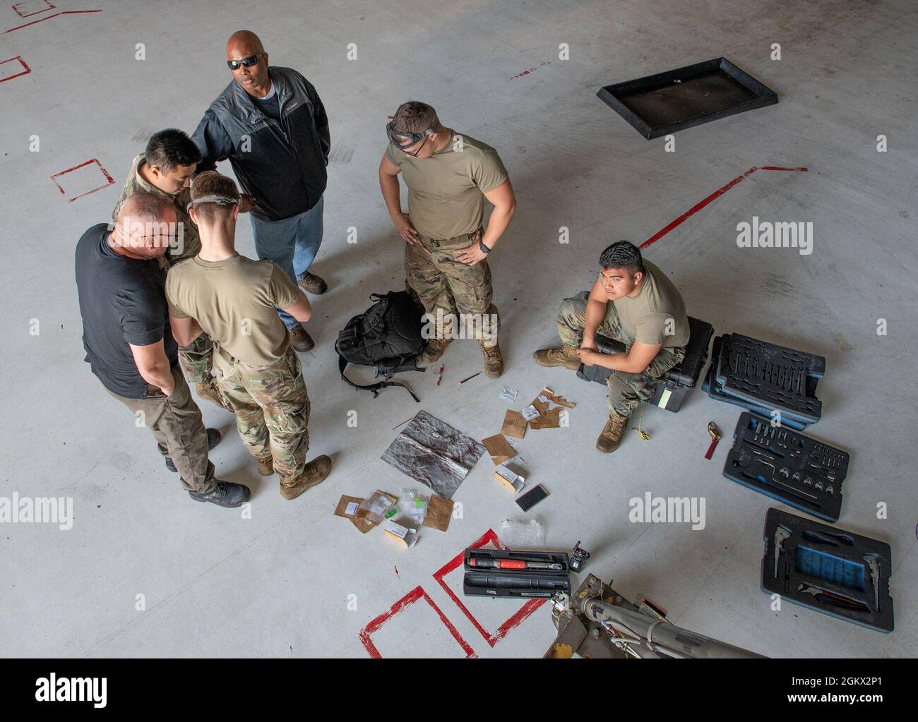 Ground maintenance crews assigned to the 60th Maintenance Group discuss ...