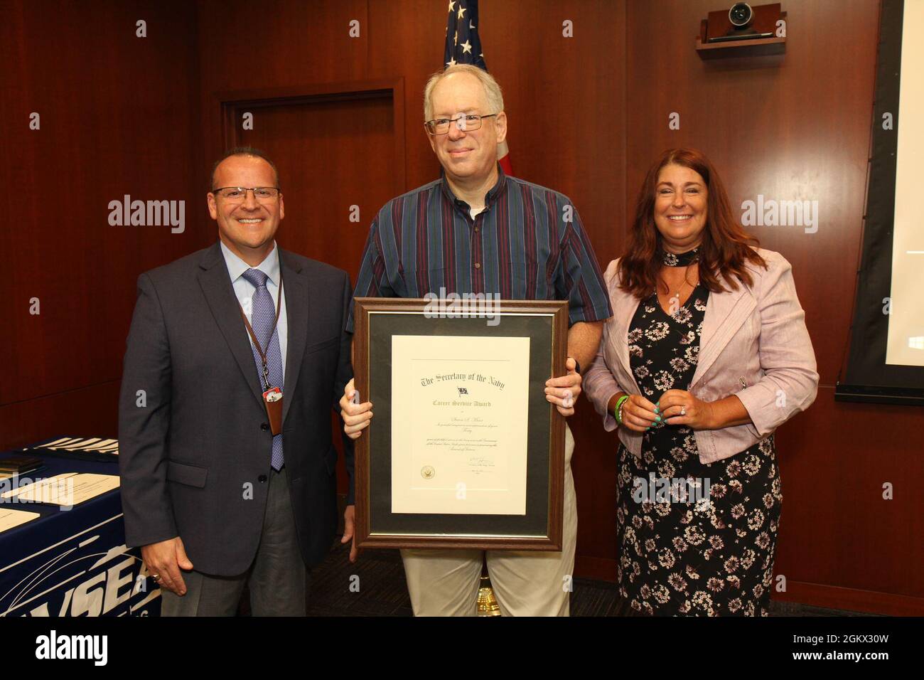 Steven Marx receives his 40-year Career Service Award during a hybrid ...