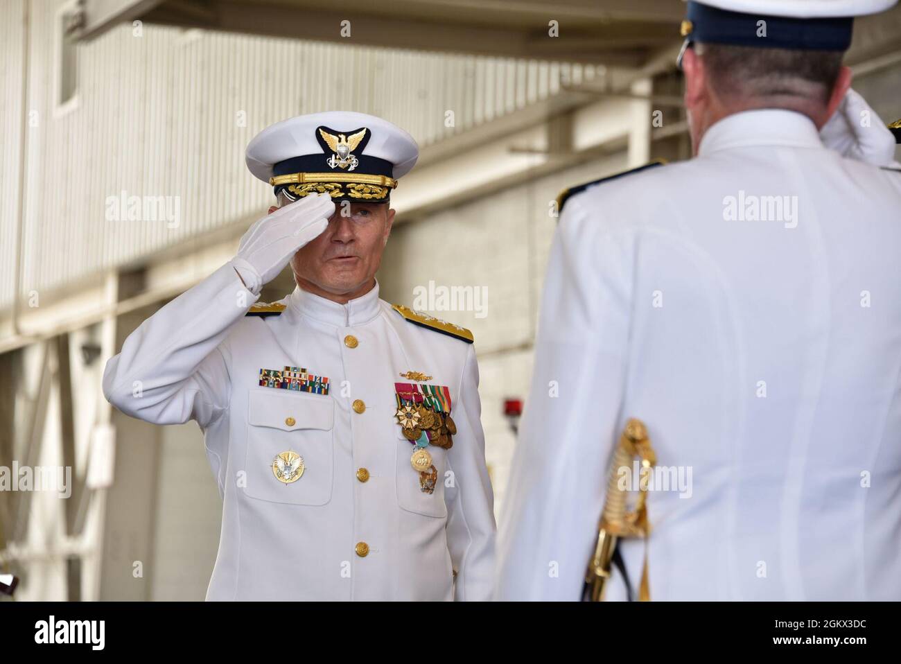 Rear Adm. Eric C. Jones, the former Seventh District Commander, salutes ...