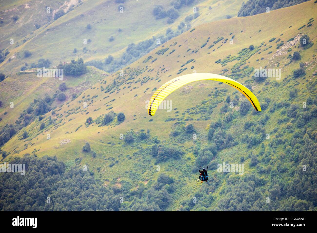 Scenic view at Gudauri View Point monument with paragliding parachutes ...