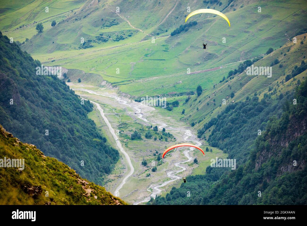 Scenic view at Gudauri View Point monument with paragliding parachutes ...