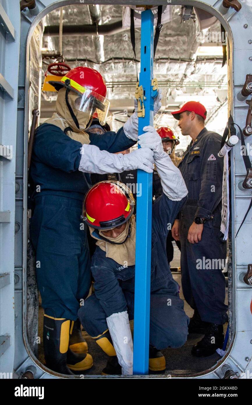 210715-N-WU807-1121 PHILIPPINE SEA (July 15, 2021) Sailors place steel ...