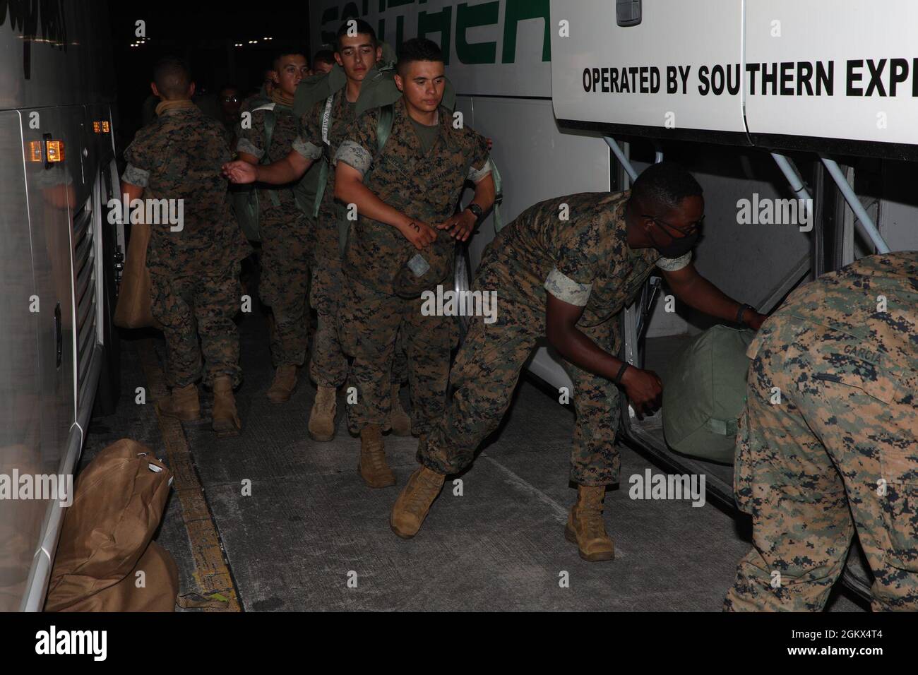U.S. entry-level Marine Combat Training load their gear to depart for ...