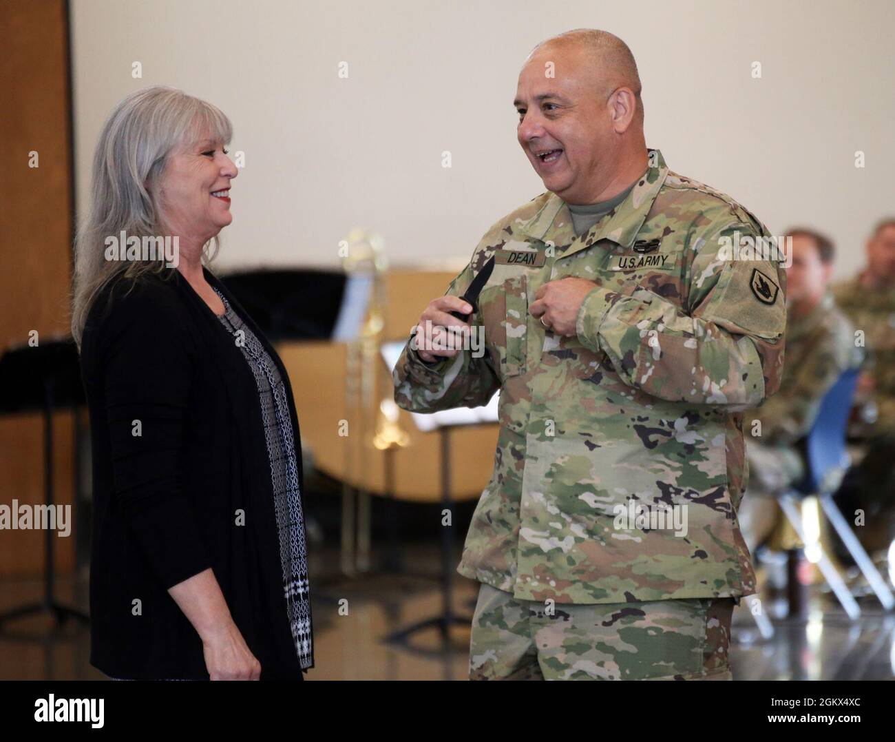 Chief Warrant Officer Five David Dean and wife Kimberly share a laugh when his old rank would ...