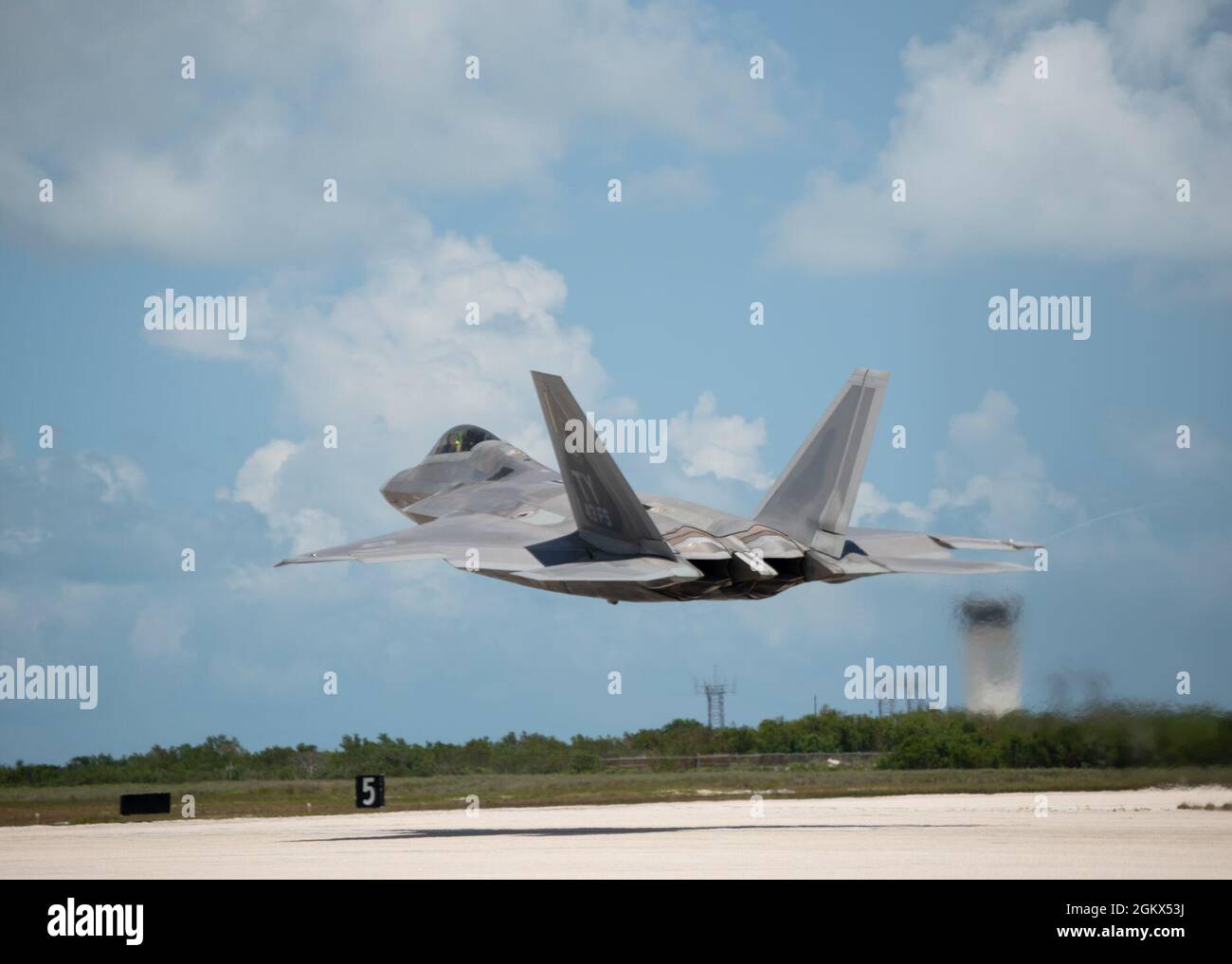 A U.S. Air Force F-22 Raptor assigned to the 325th Fighter Wing takes ...