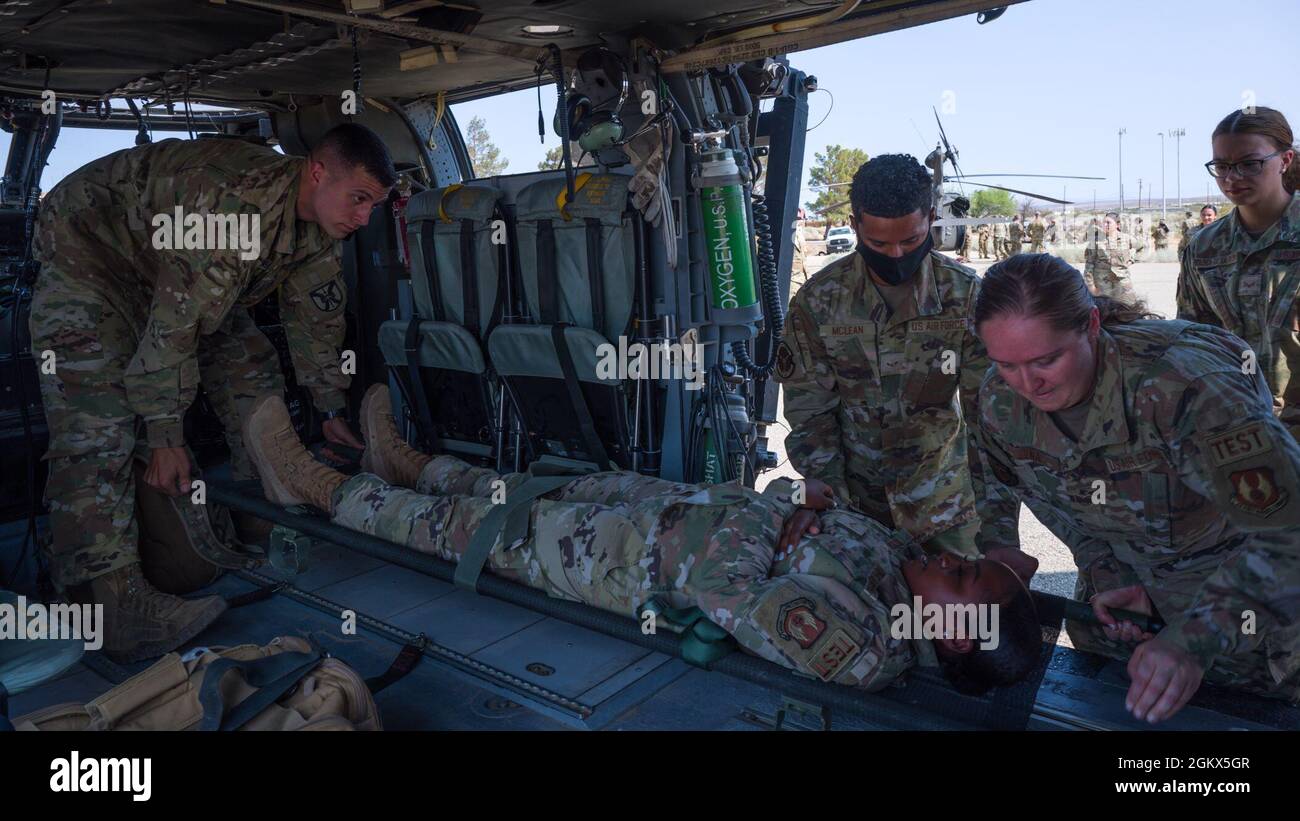 412th Medical Group load a patient onto a UH-60 Blackhawk helicoper ...