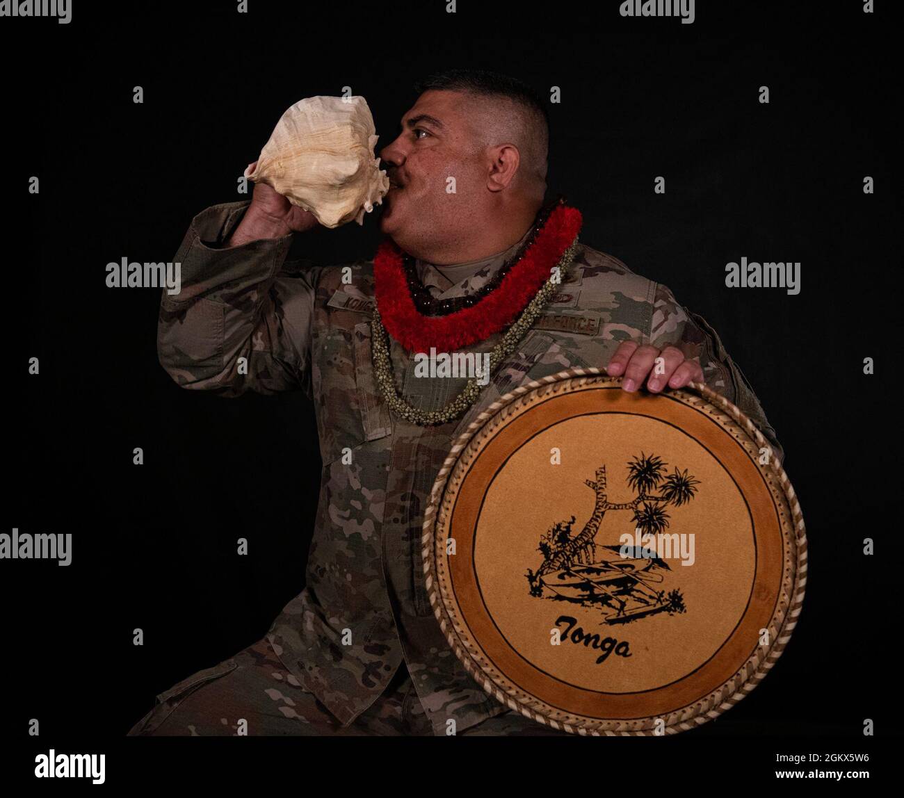 Col. Robert Kongaika, 56th Maintenance Group deputy commander, blows ...