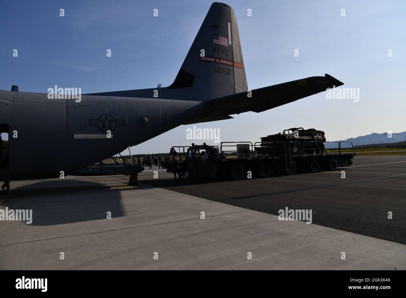 A parachuted rigged, palletized Humvee was loaded onto one of the 815th ...
