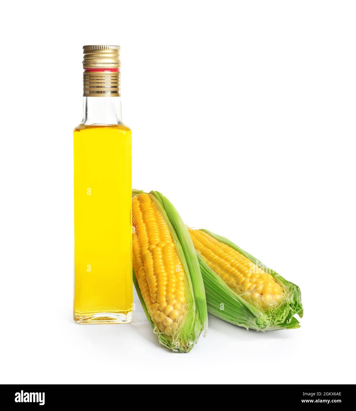 Glass bottle with corn oil and ripe cobs on white background Stock ...