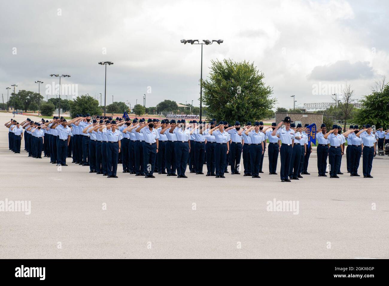 U.S. Air Force Airmen and Space Force Guardians basic military graduation and coining ceremony ...