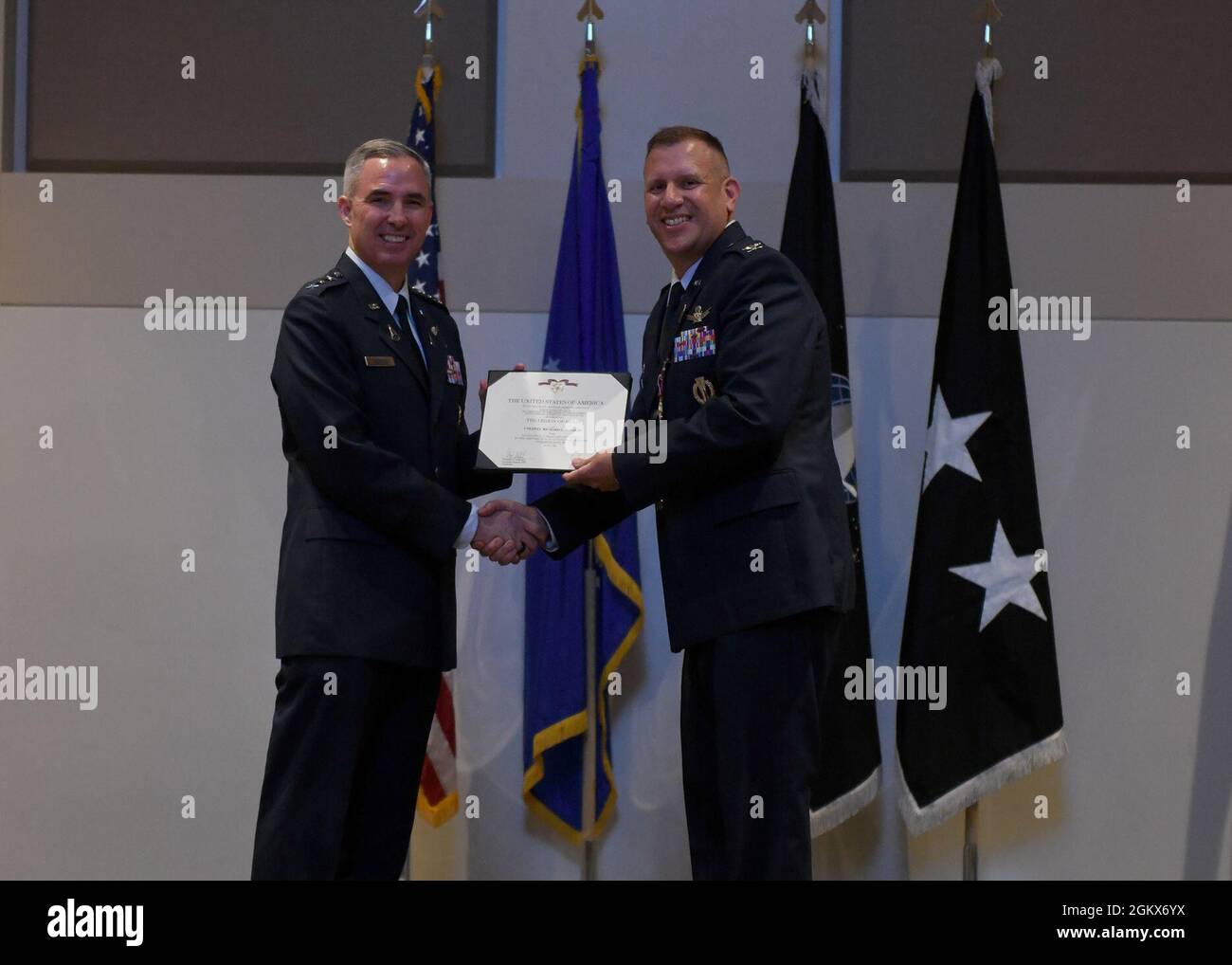 Col. Richard Bourquin, outgoing Space Delta 4 commander, poses with Lt ...