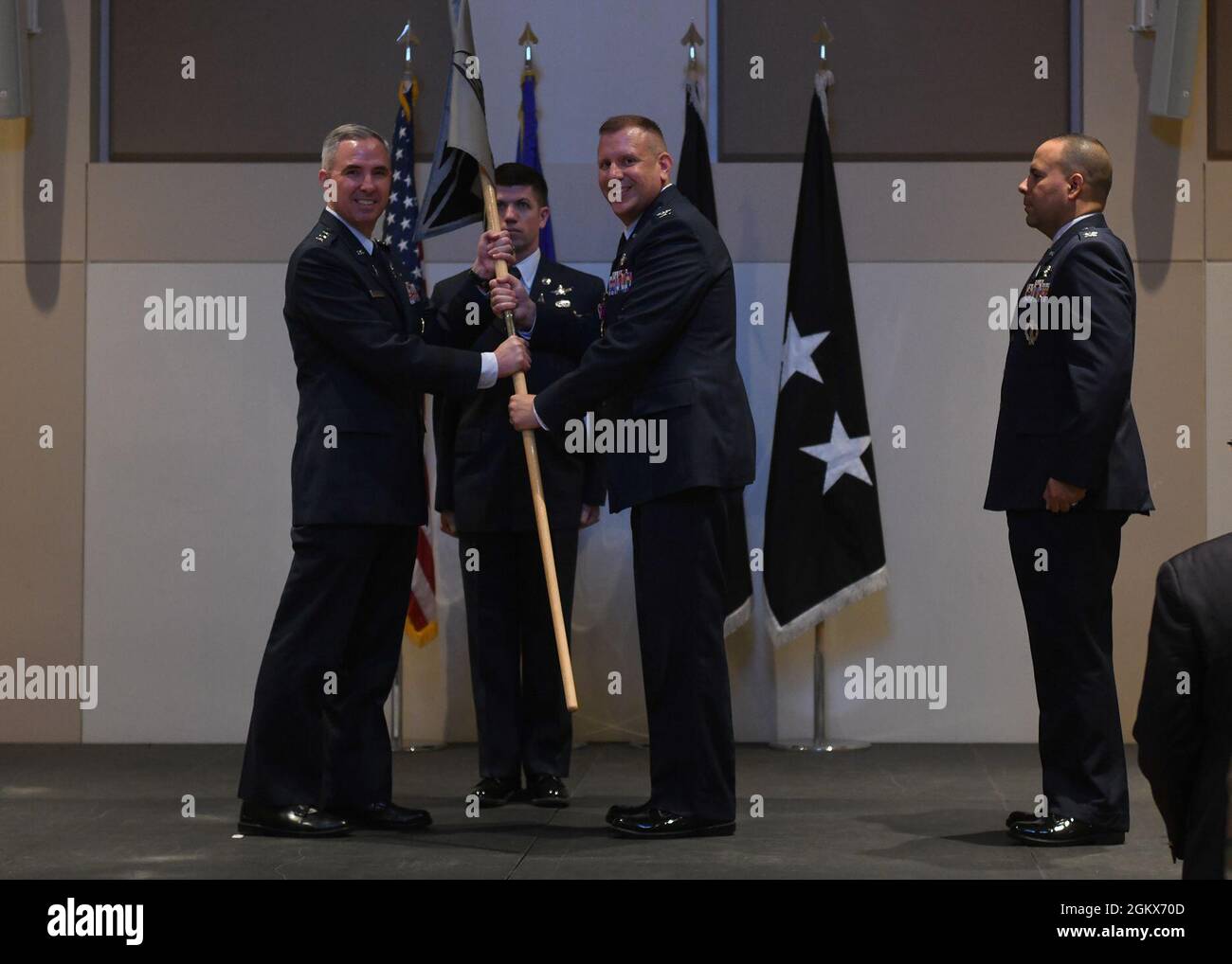 Col. Richard Bourquin, outgoing Space Delta 4 commander, passes the ...