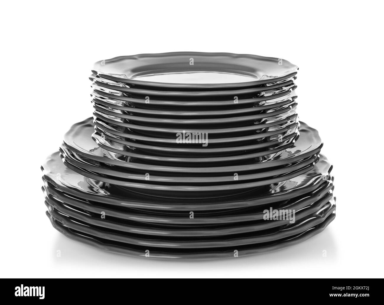 Stack of plates on white background Stock Photo - Alamy