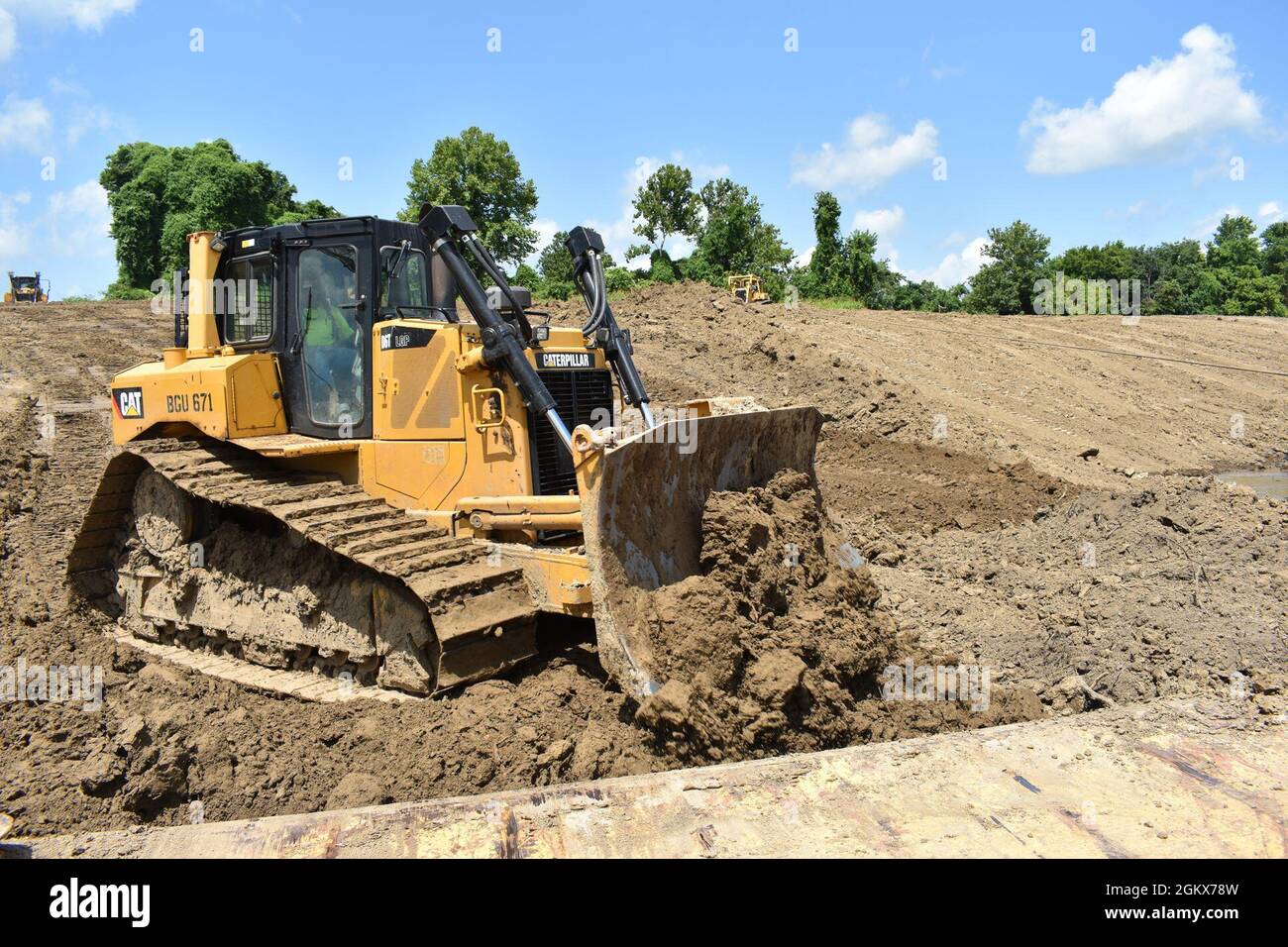 Heavy equipment operators from the U.S. Army Corps of Engineers ...