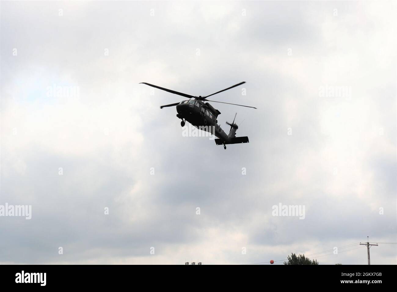 A UH-60 Black Hawk helicopter flies overhead and other training ...