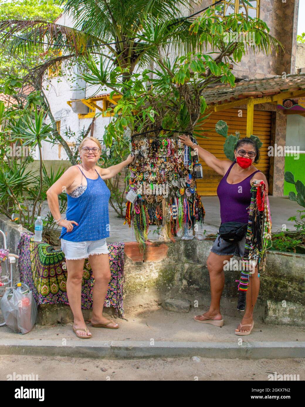 Two Brazilian women selling small items in the street in Niteroi, Rio ...