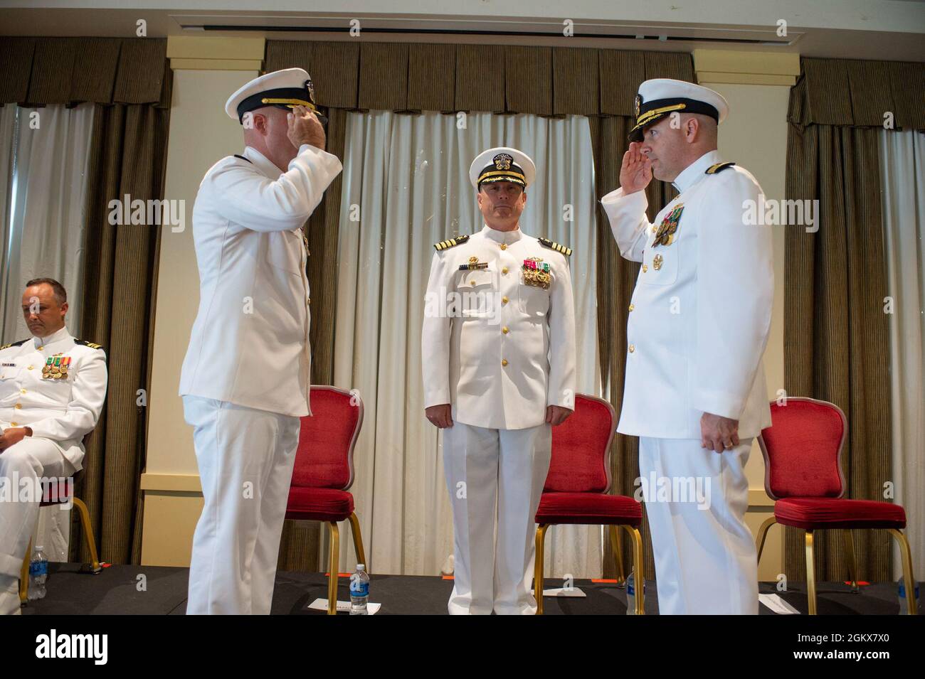 Cmdr. Jon Quimby, left, relieves Capt. Michael Delaney as commanding ...