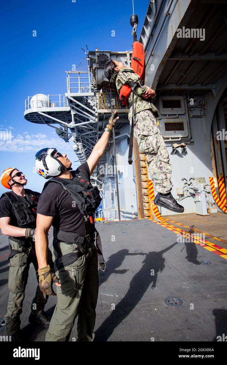 U.S. Navy Petty Officer 2nd Class Ty Nichols, a crew chief with ...