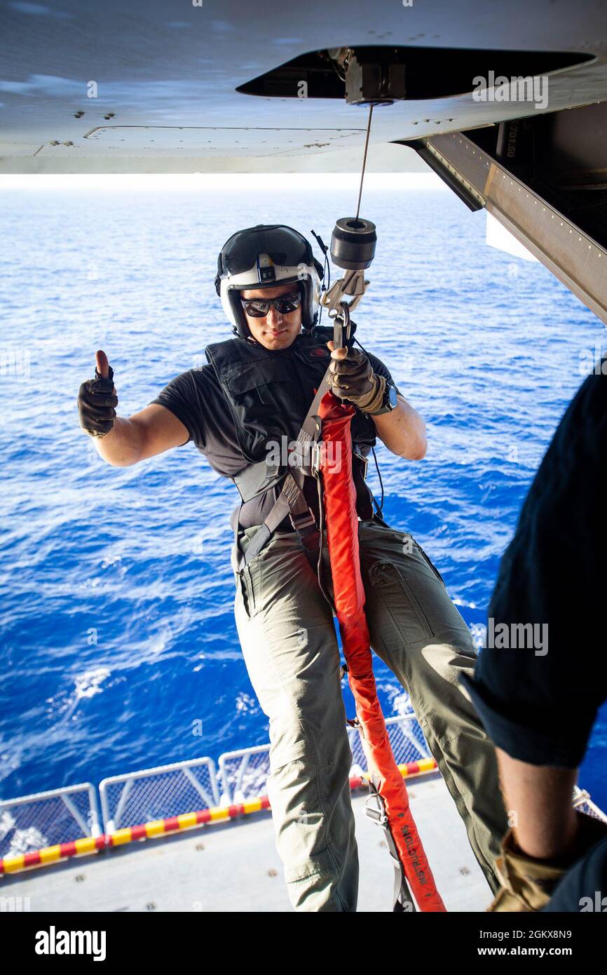 U.S. Navy Petty Officer 2nd Class Ty Nichols, a crew chief with ...
