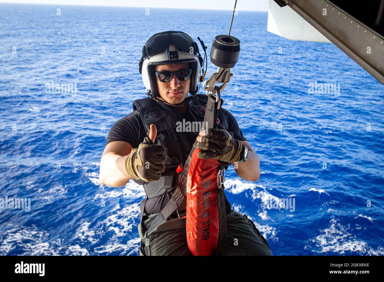 U.S. Navy Petty Officer 2nd Class Ty Nichols, a crew chief with ...