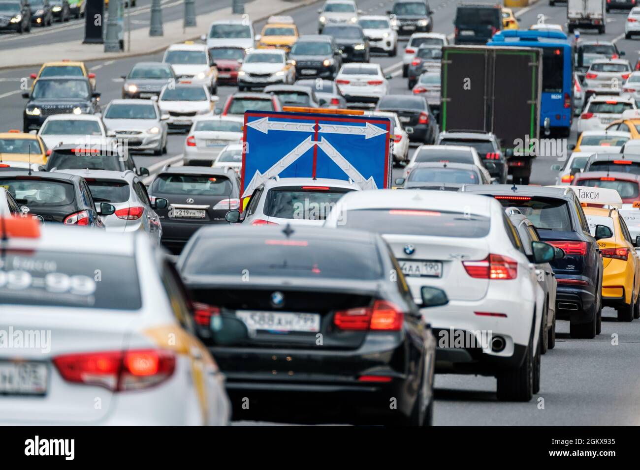 Traffic on a multi-lane road in big city center downtown, day time ...