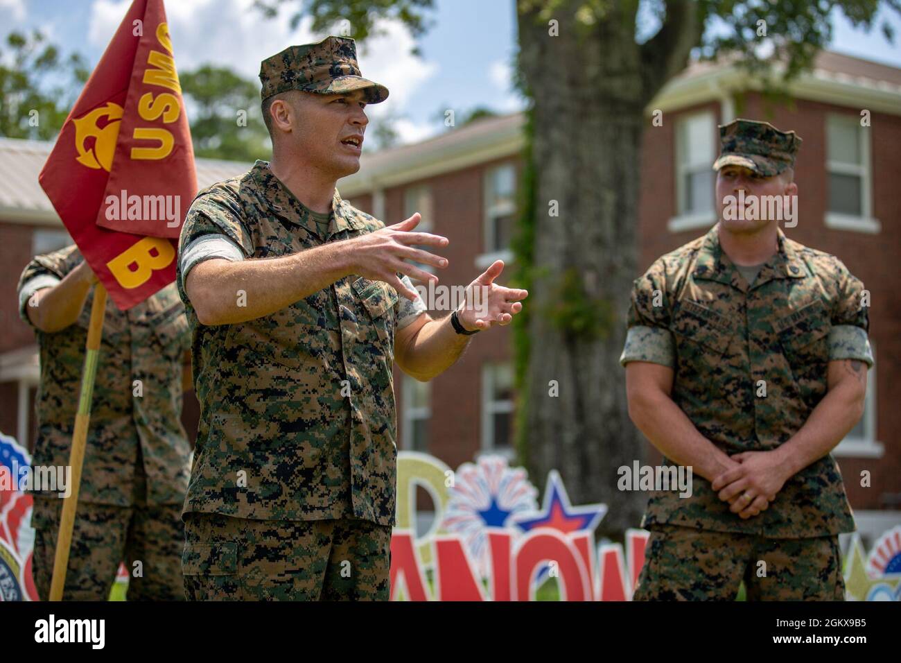 U.S. Marine Corps Capt. Brenden D. McDaniel, left, bravo company ...