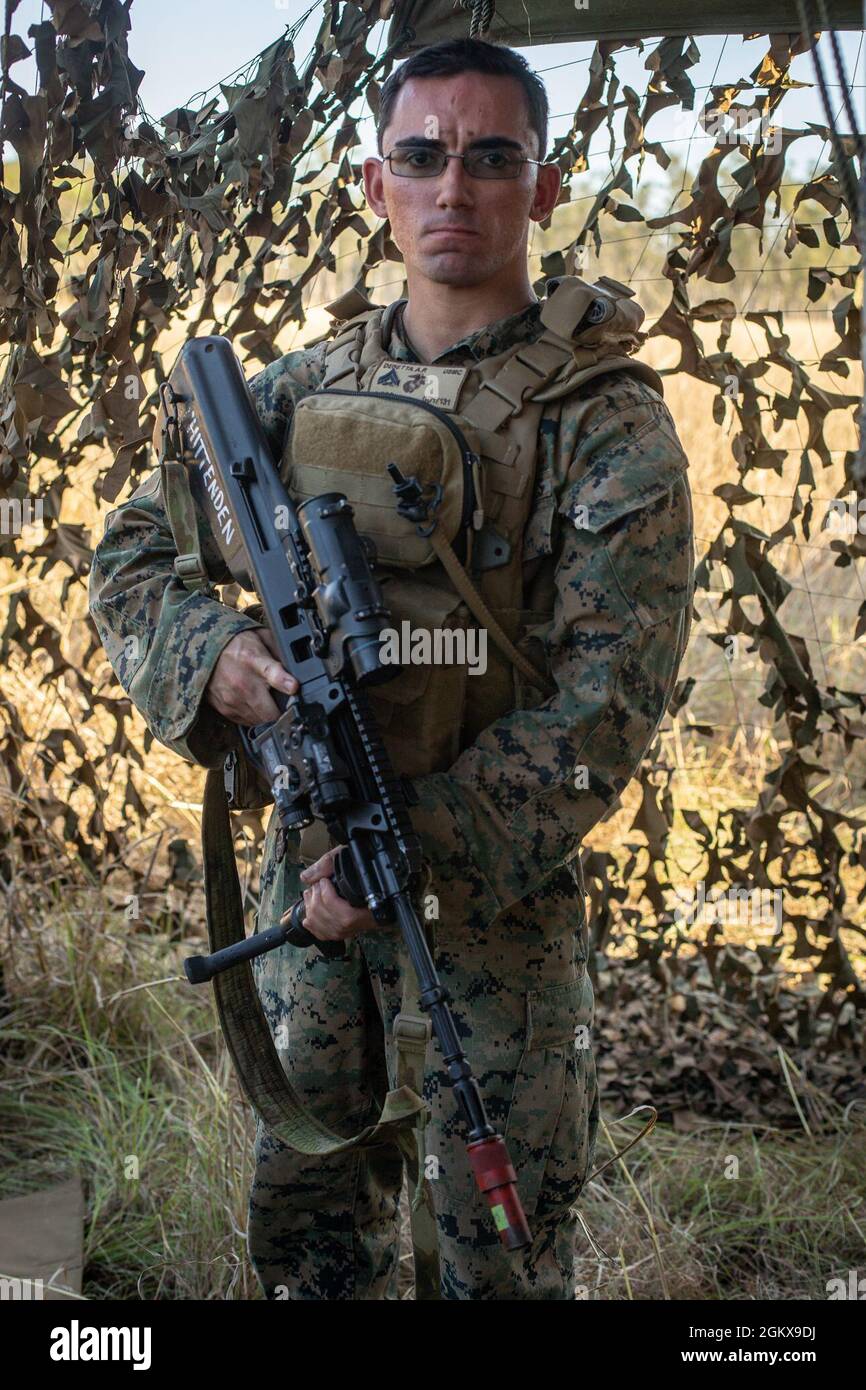 U.S. Marine Corps Cpl. Albert Debetta, a cannoneer with Golf Battery ...