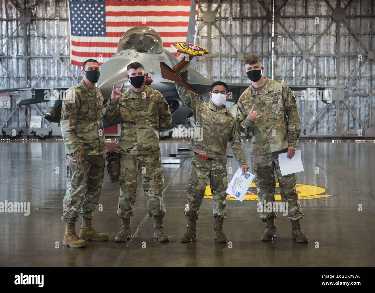 Airmen with the 14th Aircraft Maintenance Unit (AMU) celebrate with ...