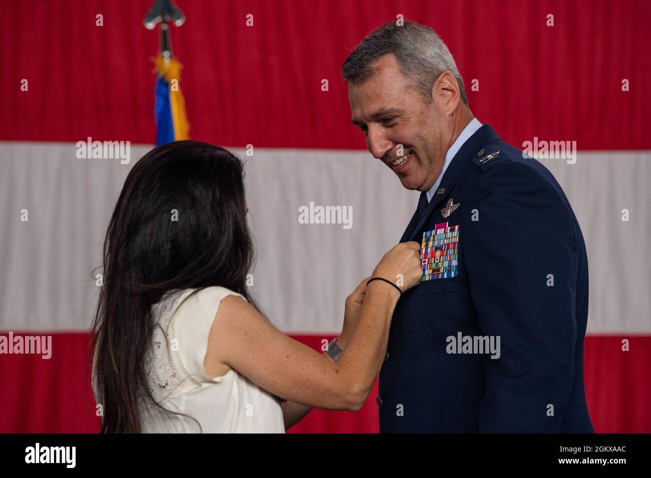 Gwen Haden, wife of U.S. Air Force Col. Ryan Haden, places the ...