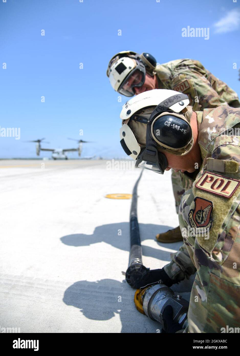 U.S. Air Force Senior Airman Andrew Lu, front, 35th Logistics Readiness ...