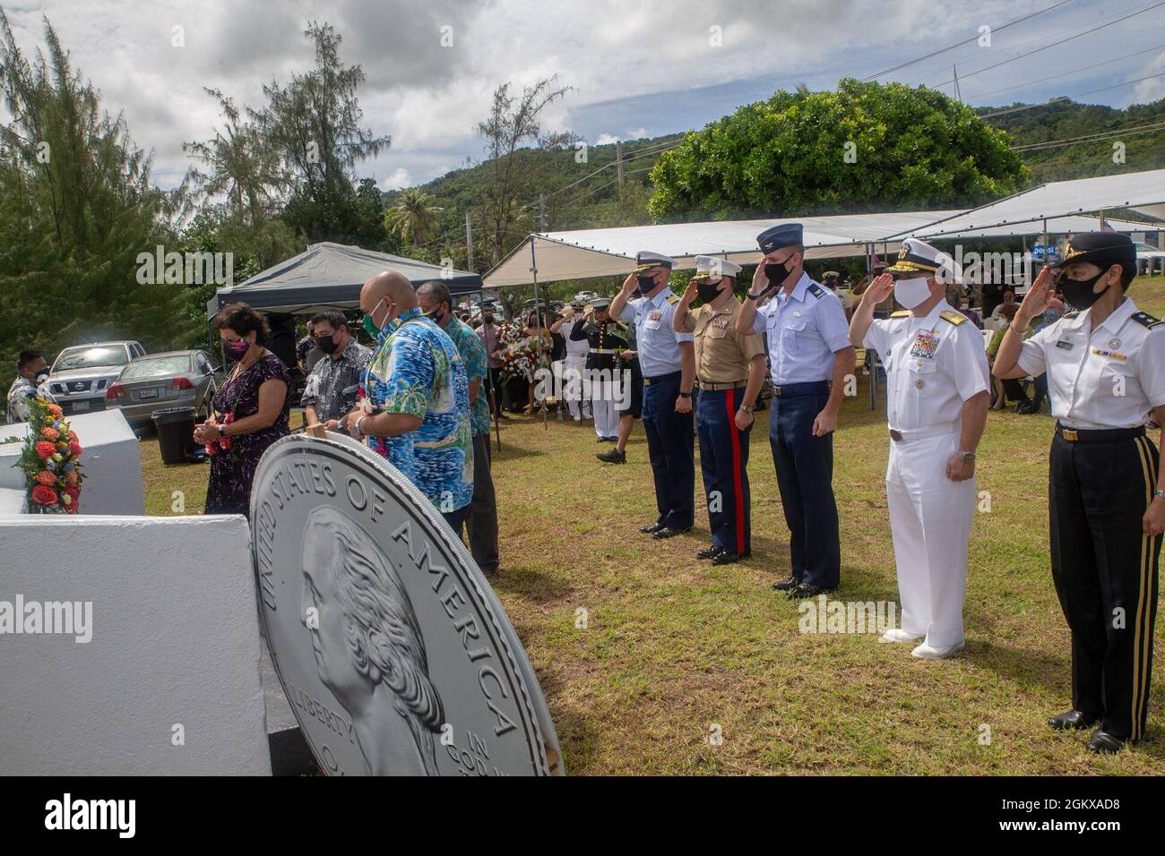 Senior leaders render a salute during a wreath laying ceremony and ...