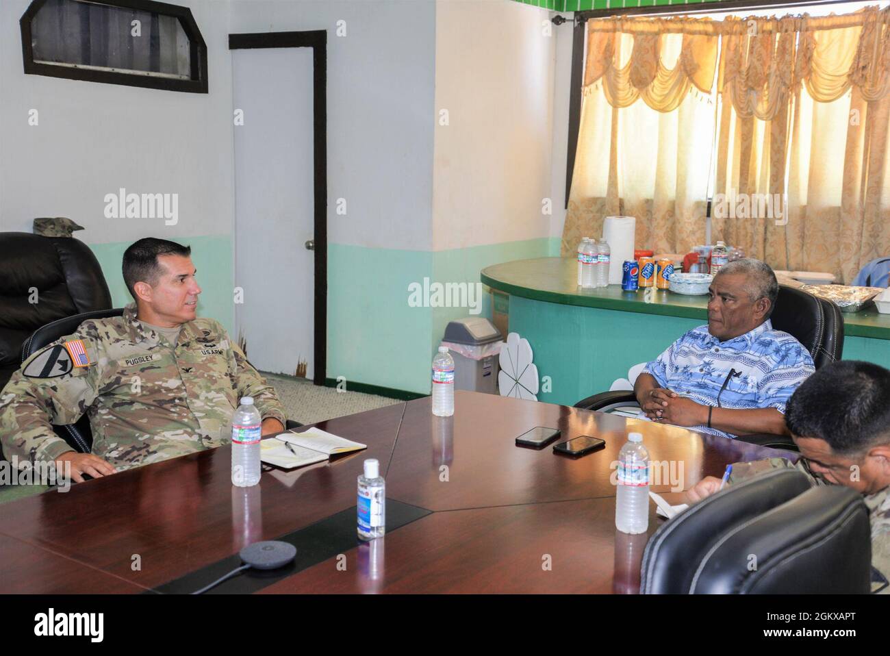U.S. Army Garrison-Kwajalein Atoll Commander Col. Thomas Pugsley, left ...