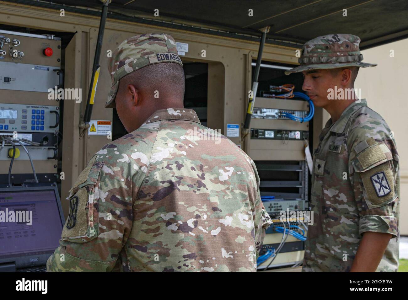 U.S. Army Sgt. Jonathan Edwards and Spc. Michael Havellana from the ...