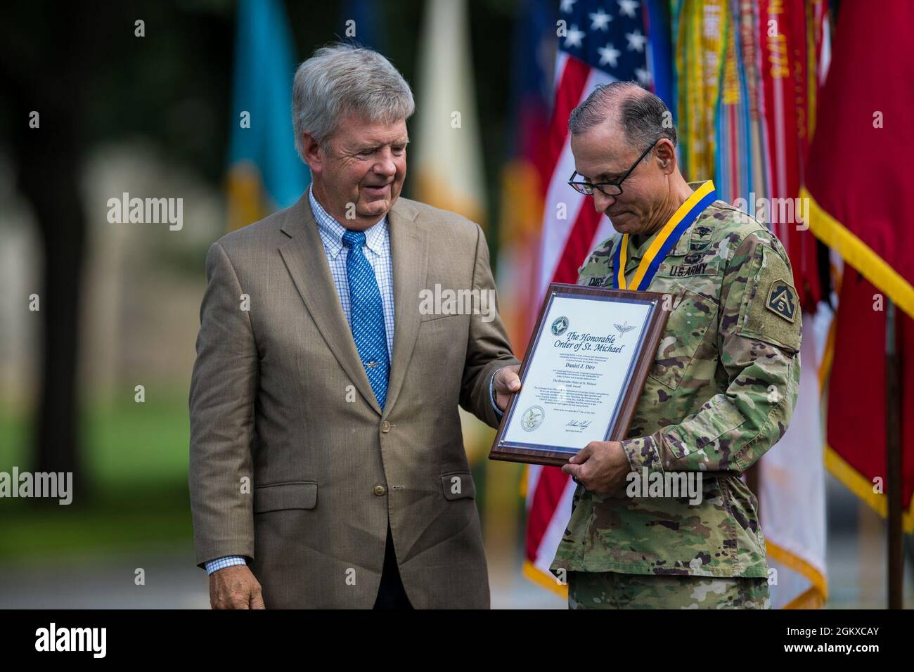 Retired U.S. Army Maj. Gen. William “Tim” Crosby, left, former Program ...