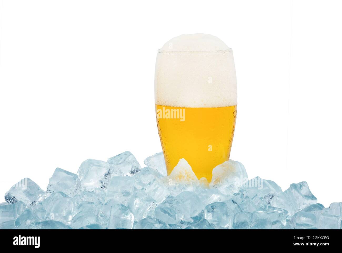 Close up one full glass of cold lager beer on ice cubes isolated on ...