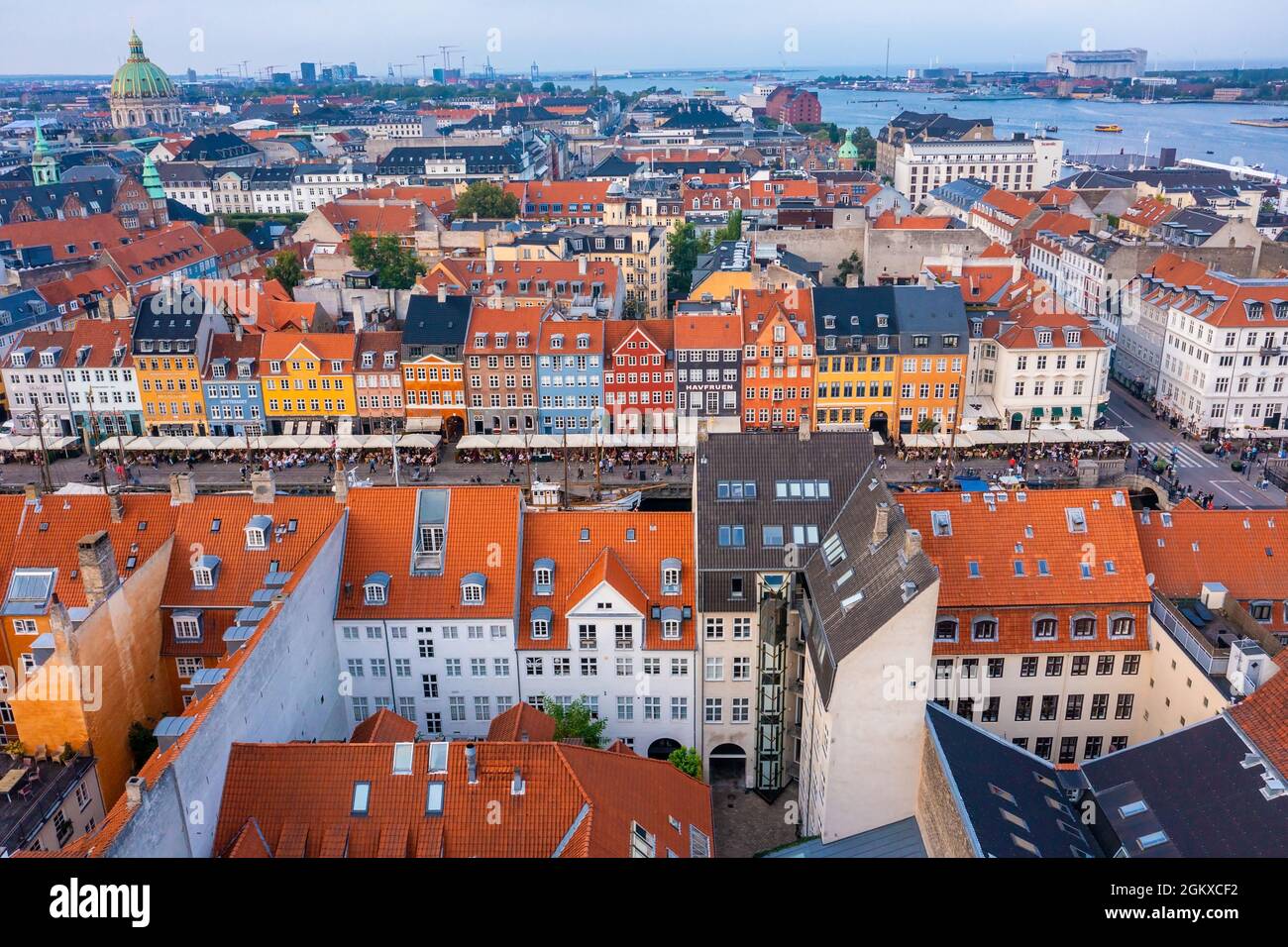 Famous Nyhavn pier with colorful buildings and boats in Copenhagen ...