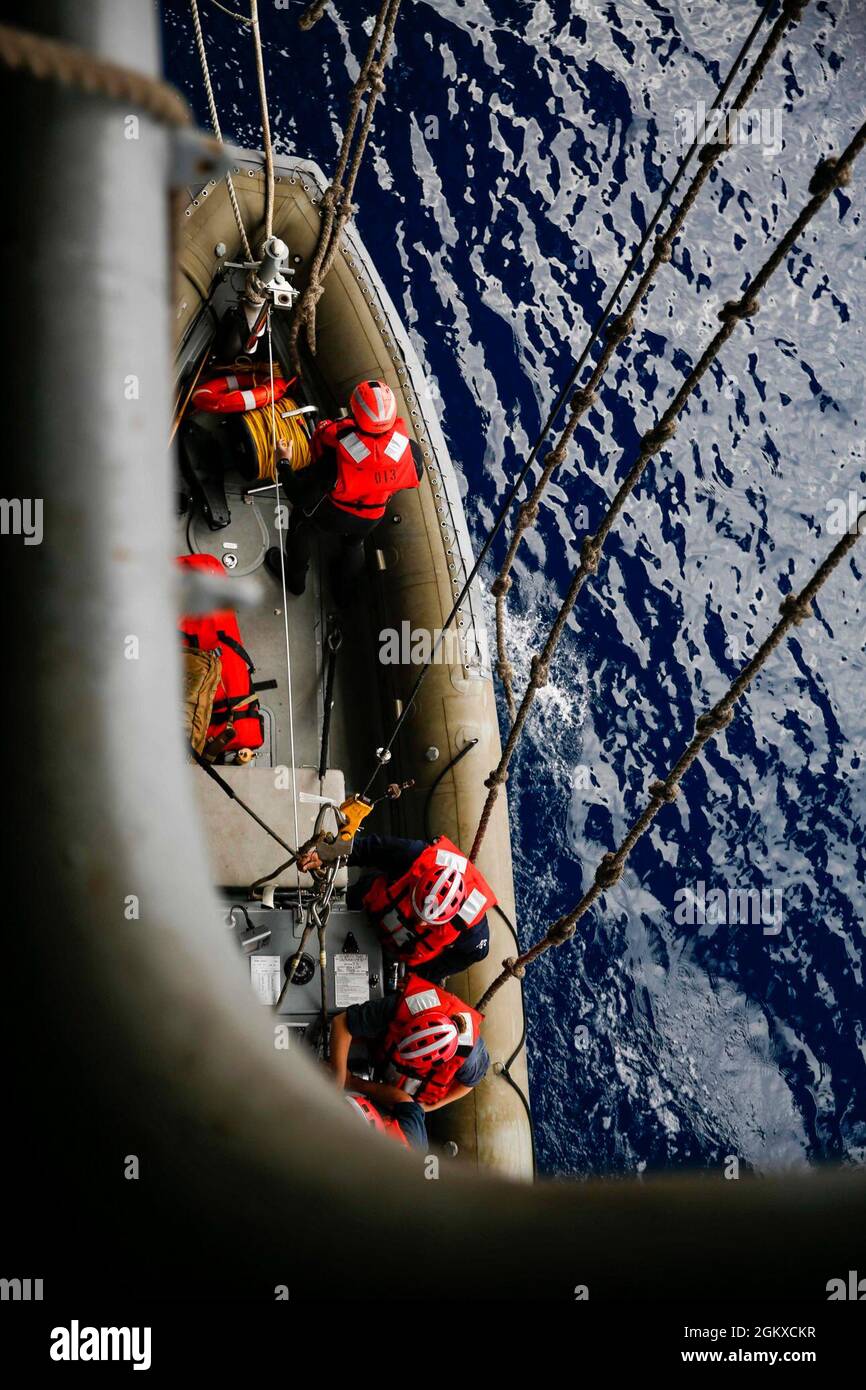 PACIFIC OCEAN (July 17, 2021) Sailors man a lifeboat during a man ...