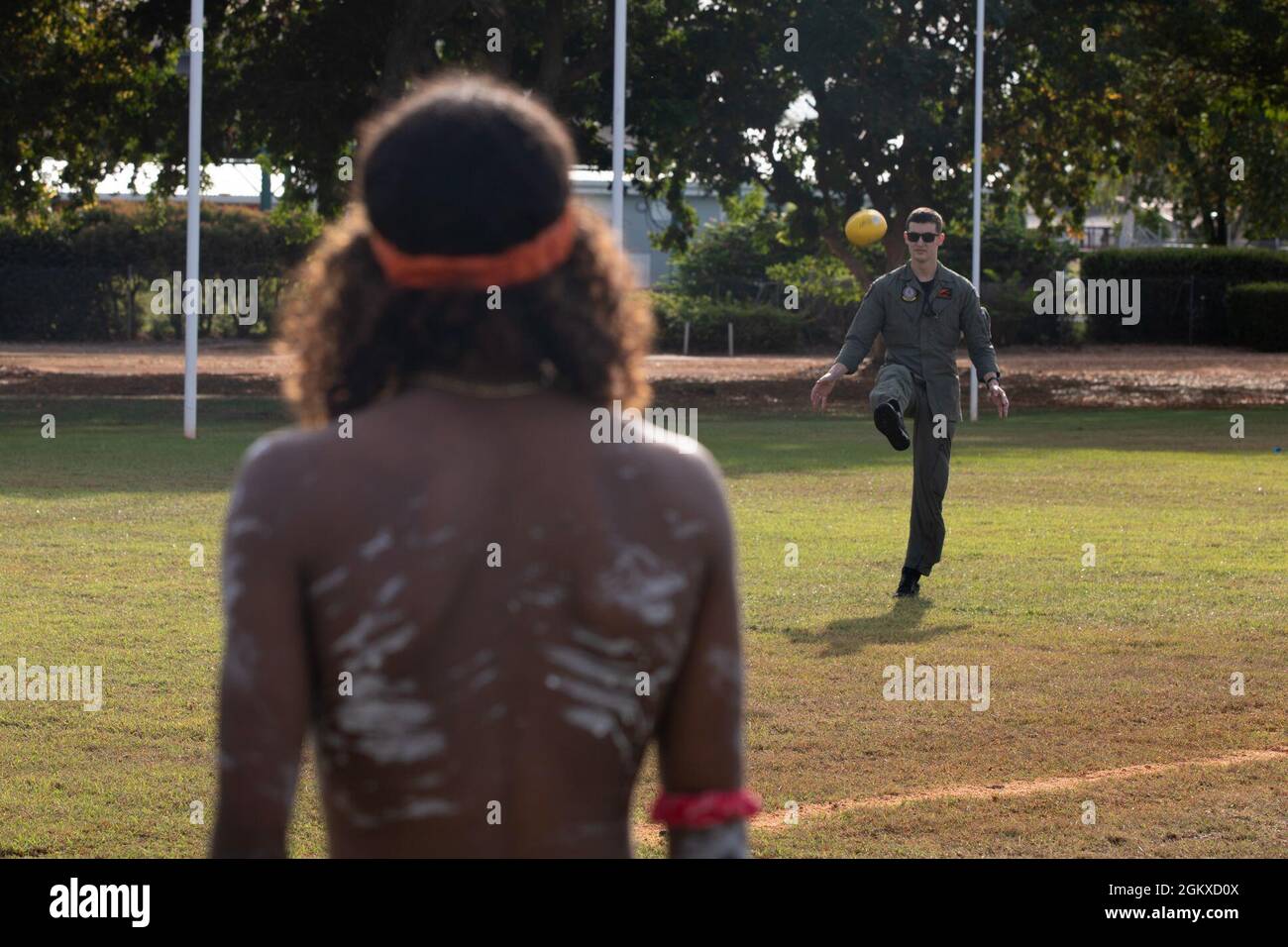 An Australian Defense Force pilot plays a game of Australian rules ...