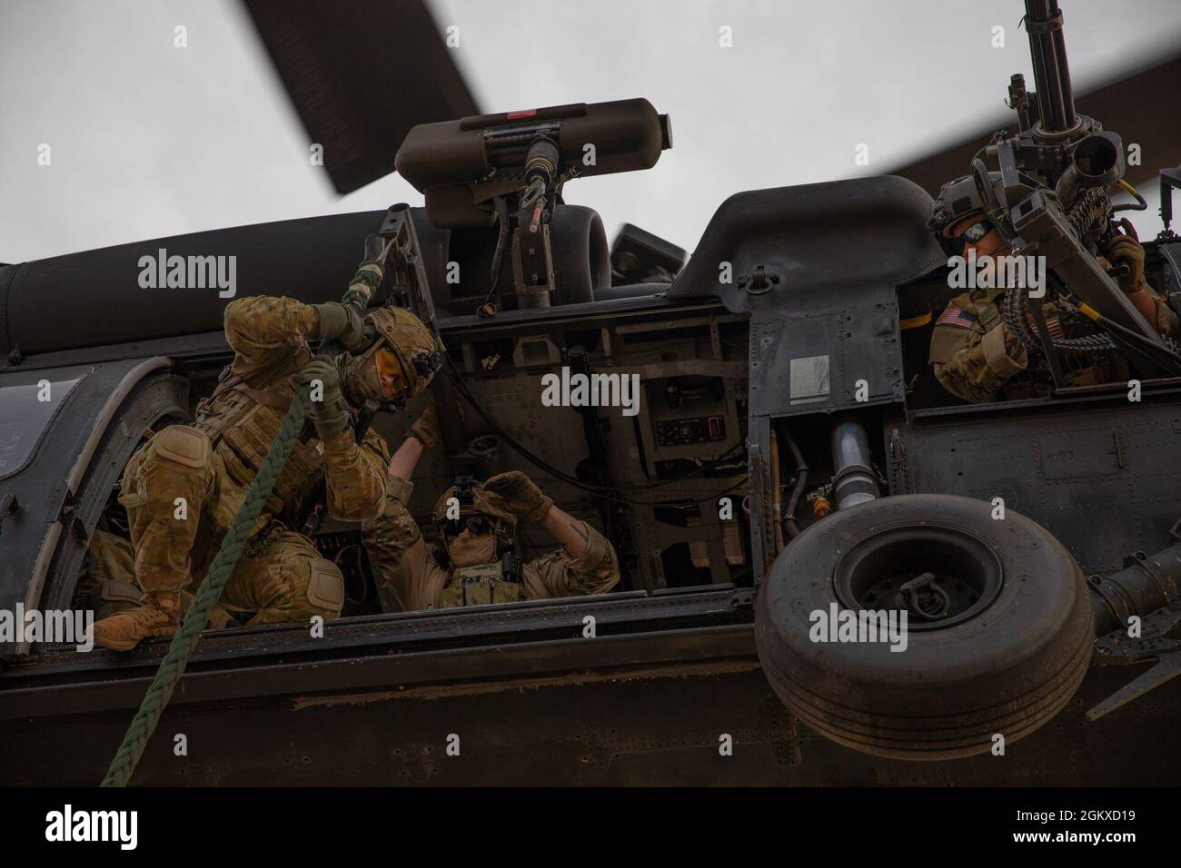 Australian Defence Force military personnel rappel out of a U.S. Army ...