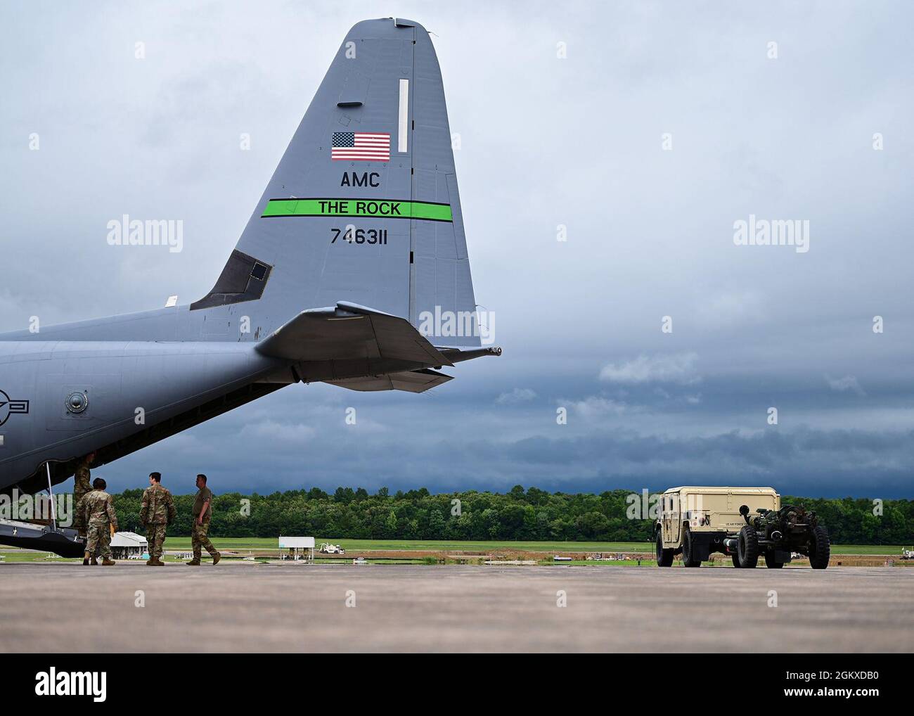 Airmen assigned to the 19th Airlift Wing prepare to load a High ...