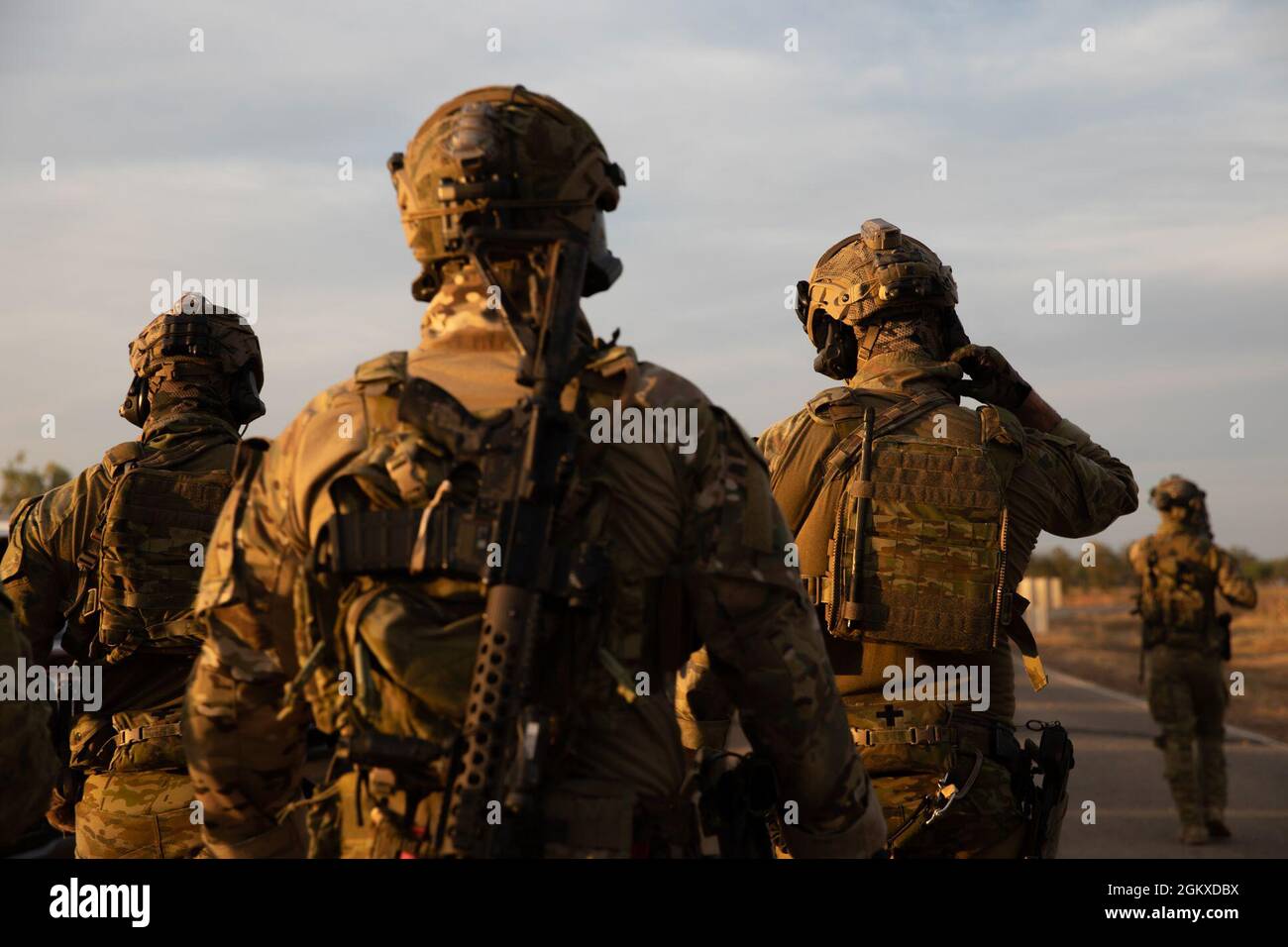 Australian Defence Force military personnel walk toward their ...