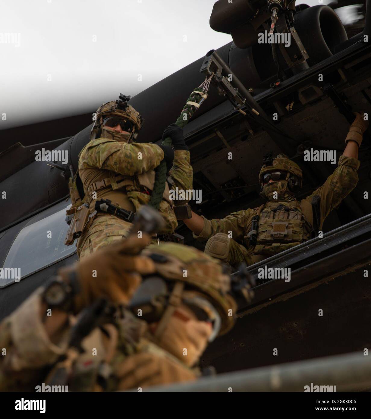 Australian Defence Force military personnel rappel out of a U.S. Army ...