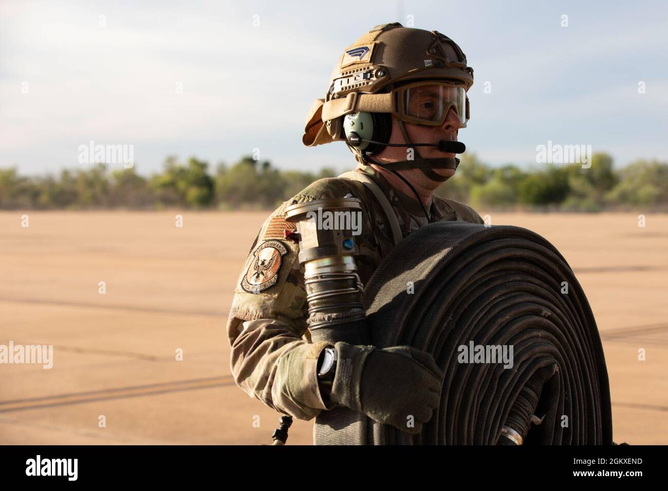 A loadmaster with the 1st Special Operations Squadron carries equipment ...
