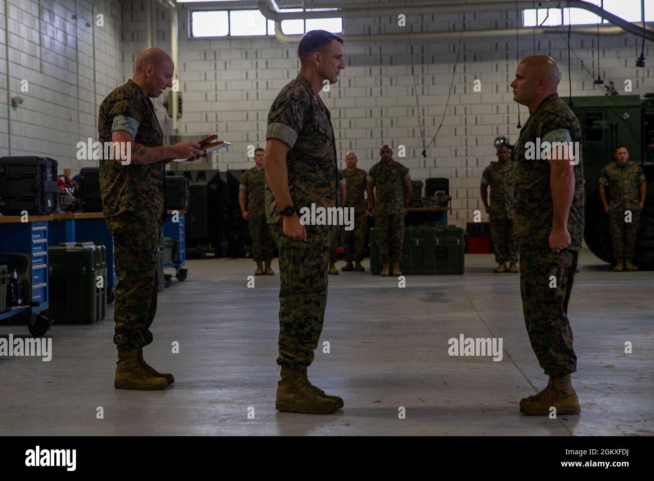 U.S. Marine Corps Gunnery Sgt. Adam Plambeck, right, a native of ...