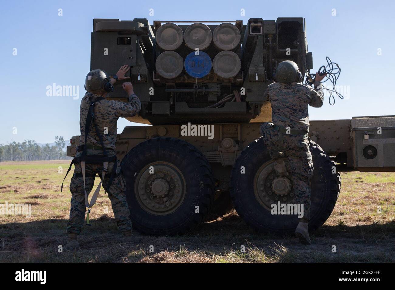 U.S. Marines with 3d Battalion, 12th Marines, 3d Marine Division, load ...