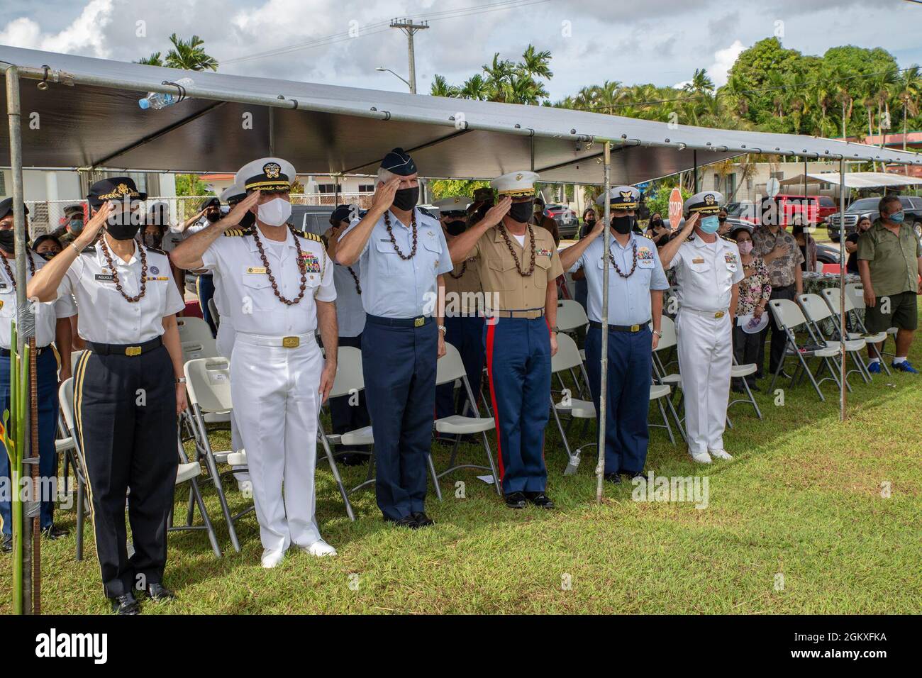 Senior leaders render a salute during the playing of the national ...