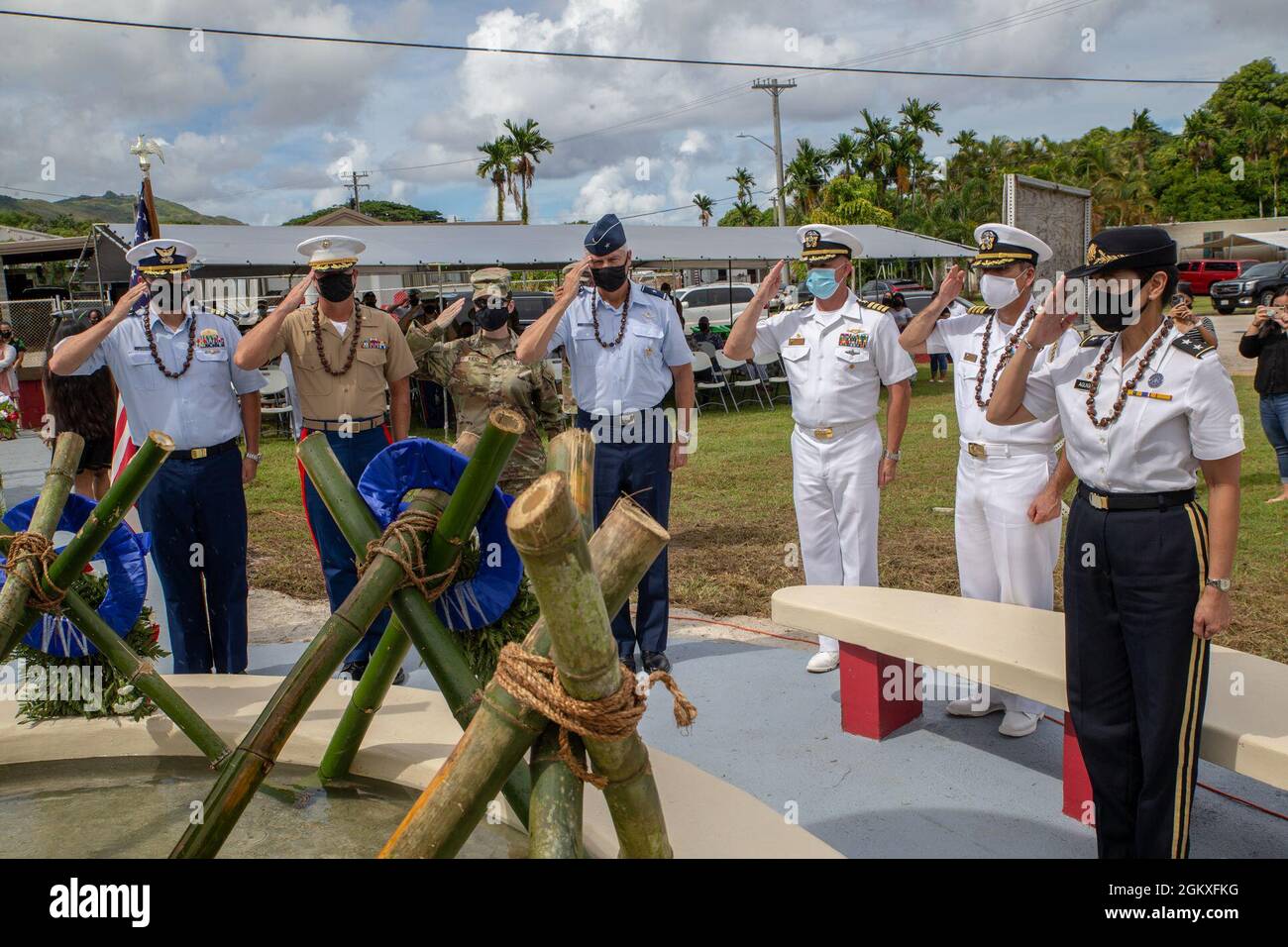 Senior leaders render a salute during a wreath laying ceremony and ...