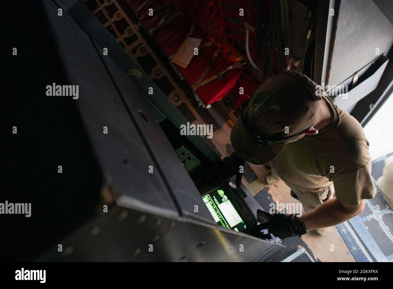 U.S. Air Force Staff Sgt. Wesley Zech, checks the load plan of a U.S ...