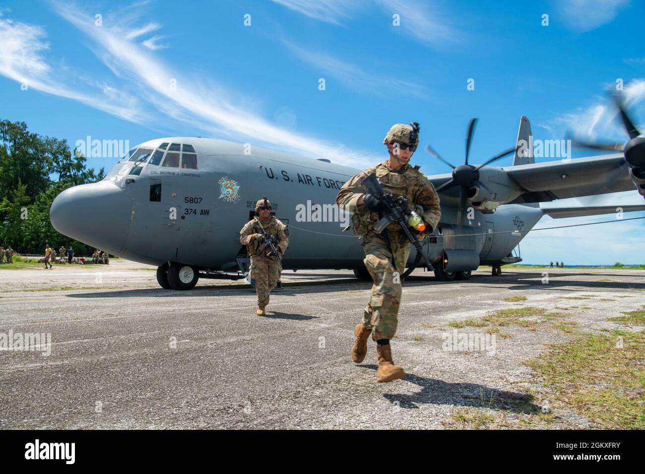 U.S. Army soldiers from the 14th Cavalry Regiment exit a U.S. Air Force ...