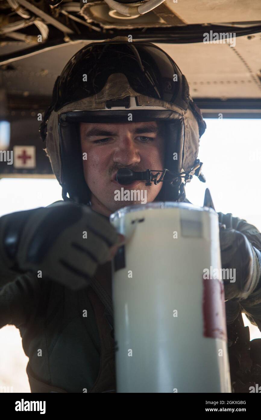 U.S. Marine Corps Sgt. Michael Sennet, a UH-1Y Venom crew chief from ...